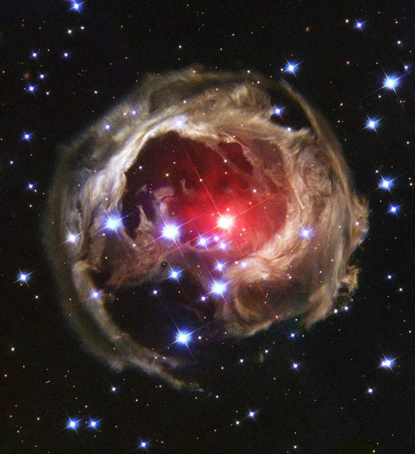 The star V838 Monocerotis illuminates the surrounding dust in the constellation Monocero, 20,000 light-years from Earth.