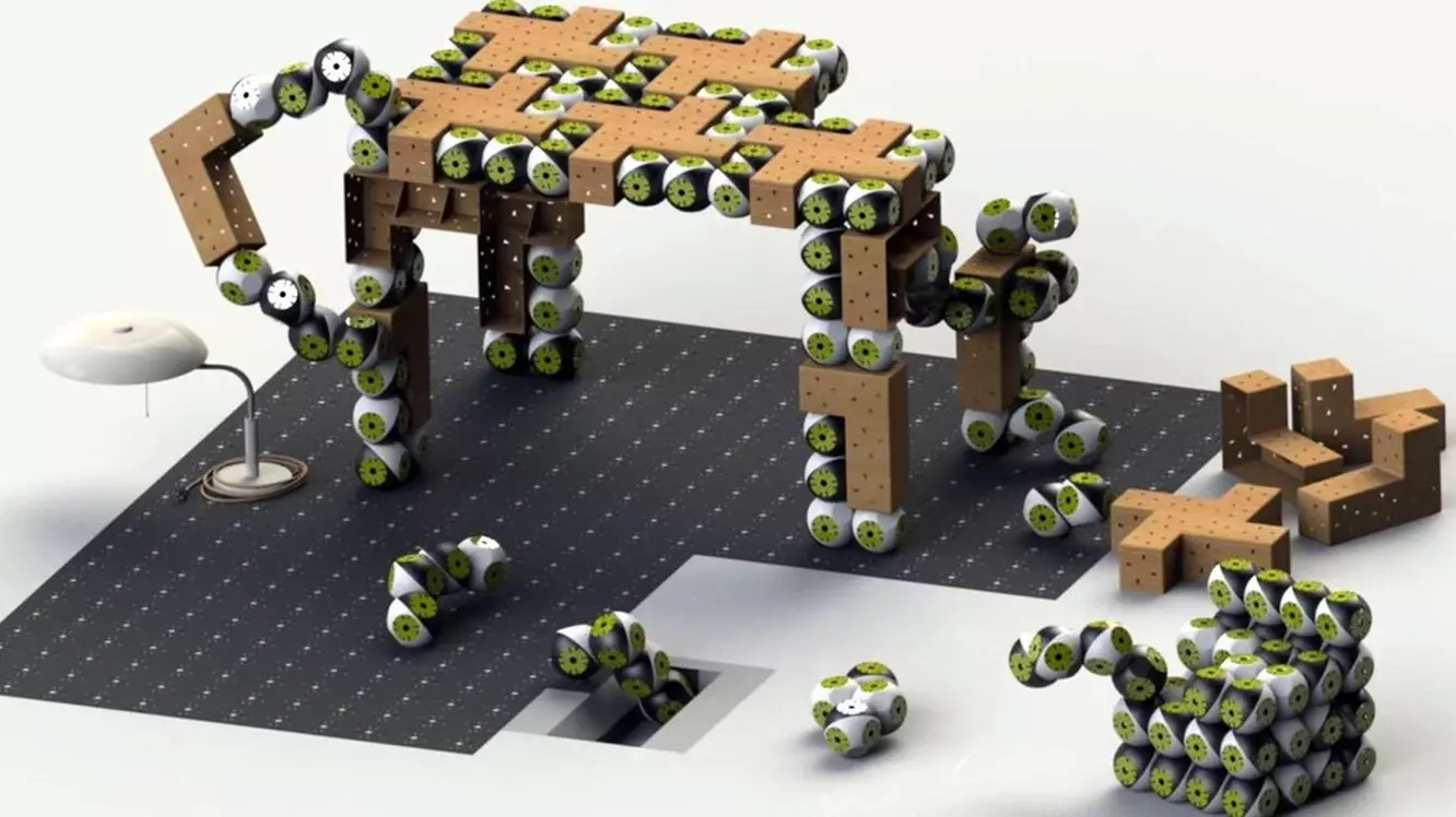 Roombots 是 22 厘米长的小型机器人，类似于六面立方体，“生活家具”。它们可以旋转和改变形状，相互对接，形成桌子、椅子、扶手椅、沙发…… Roombots也适应普通家具，变成轮子带到主人面前。