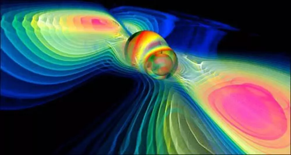 El nacimiento de ondas gravitacionales durante la colisión de agujeros negros.